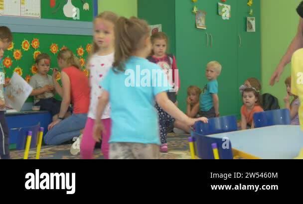 Group of Happy Children With Painted Faces Are Running and Standing Up ...