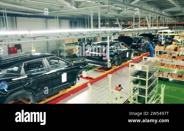 Automobile, car factory conveyor. Car bodies in the factory unit in the ...