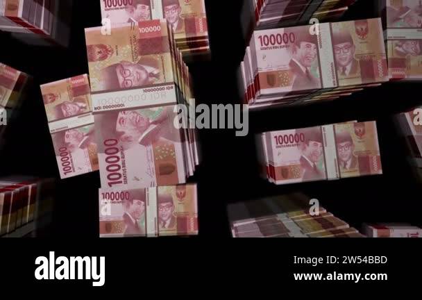 Indonesian Rupiah money pack loop. Flight over IDR banknotes stacks top ...