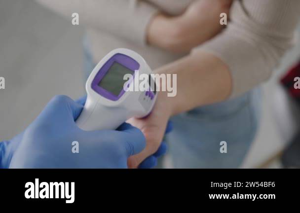 Doctor measures the temperature of his patient and shows the normal ...