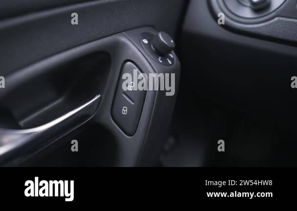 Door lock buttons inside a car. Action. Close up of car interior ...