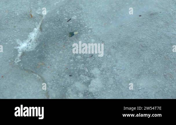 First spring thaw in ice, rotten ice, dangerous ice blowing. Earth ...