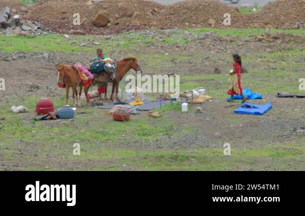 Female gypsies winding up camp in an open field at Pune India Stock ...