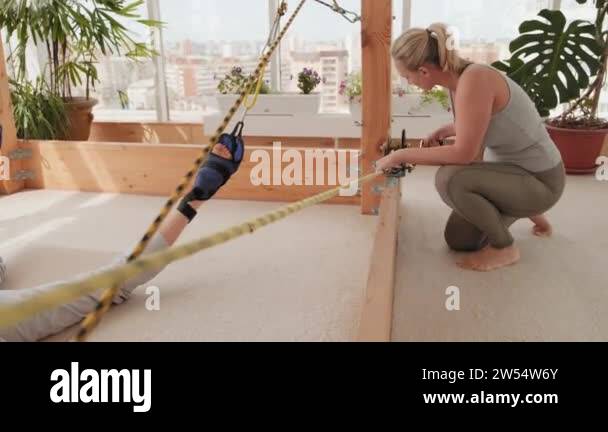 Full side-view footage of fit female instructor spinning rotary ...