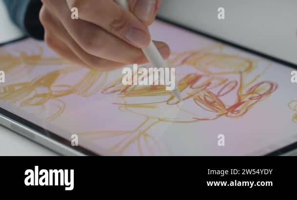 Close up view of artist drawing digital picture at display of tablet ...