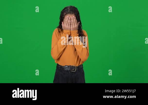 Scared frightened African American teen girl closing face with hands ...