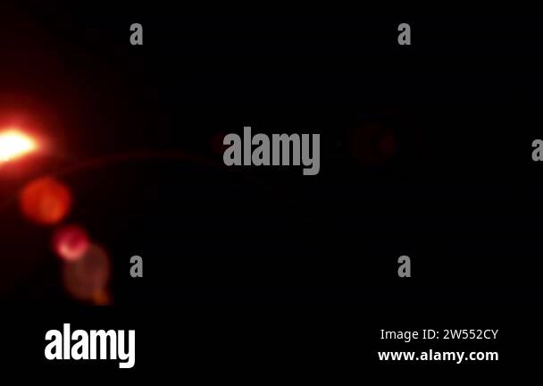 Optical golden lens flares transition seamless loop with flickering and lighting burst. 4K ...