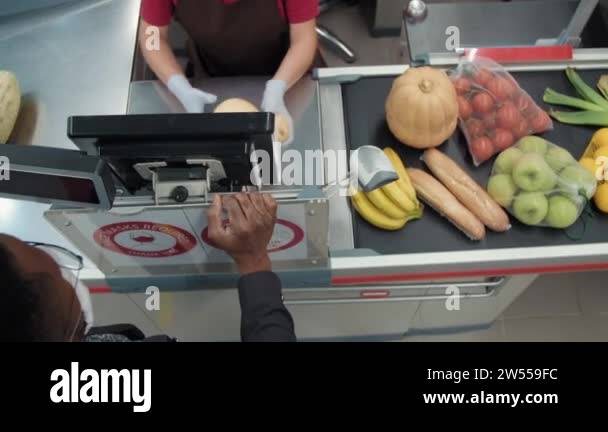 Top-view footage of unrecognizable african american customer standing ...