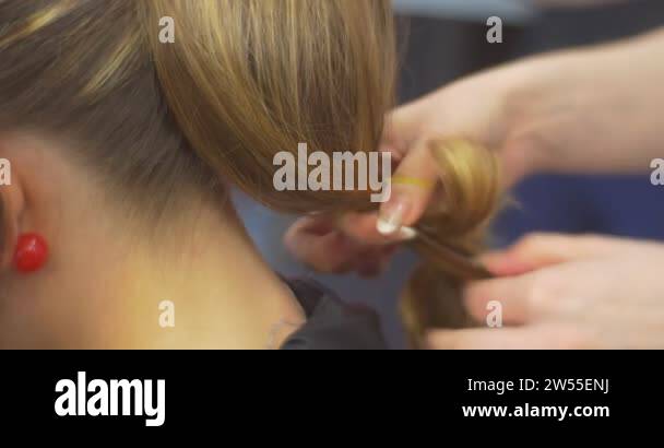 Stylist Hairdresser Is Making a Hairstyle Fixing a Hair Strands on the ...