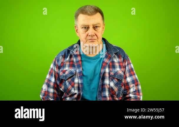 Confused puzzled, bewildered senior caucasian man in checkered shirt ...