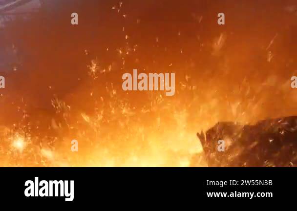 The scene of the smelting molten iron sparks in the blast furnace cast ...