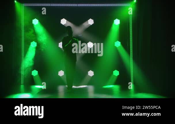 An ethnic musician plays the African rhythm instrument shekere and ...