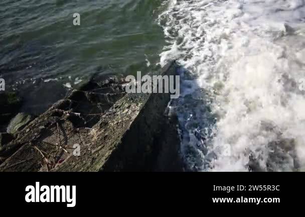 Water pollution. Dirty water from treatment plants flows through a pipe ...