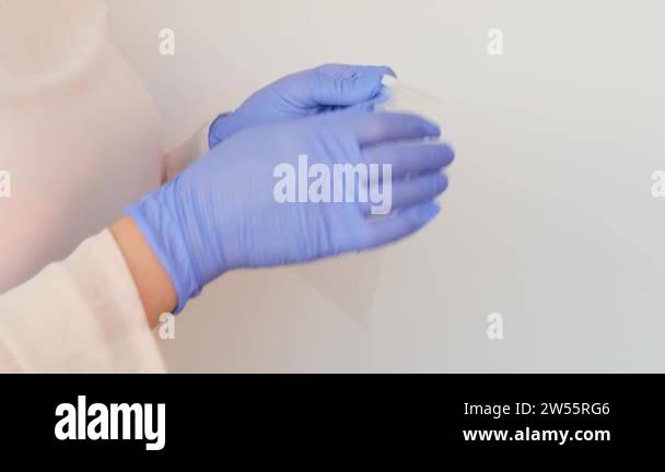 girl holds a kit for a dna test in a box, a cotton swab for scraping ...
