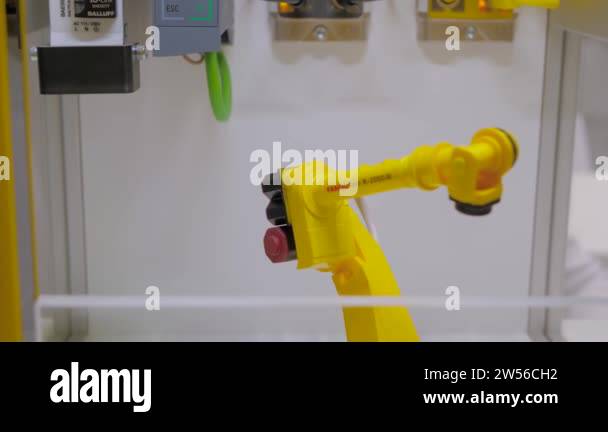 Small toy model of industrial robot arms - FANUC R-2000 at robot ...