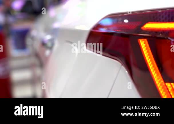 Taillight at the New Car Exhibition in a car dealership. Rear view of ...