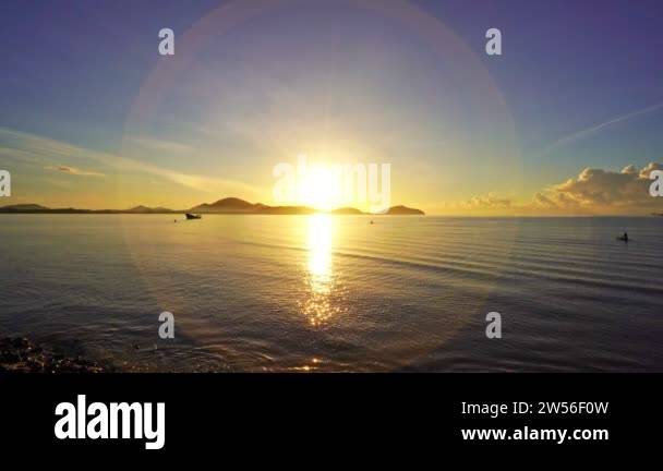 Amazing sunlight over sea sun ray and sunset or sunrise over the calm ...