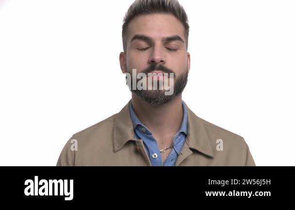 clueless guy wearing denim shirt, looking around, curiously holding ...