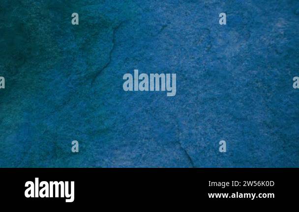 4K rain drop on heavy hard granite dark blue stone surface of cave for ...