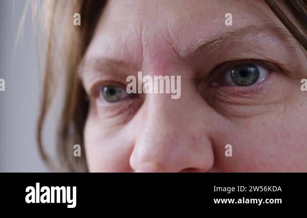 gray eye with spots on iris, wrinkles on eyelids close up, human vision ...
