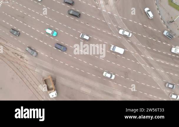 Cars pass a multi-lane complex intersection with traffic lights - drone ...