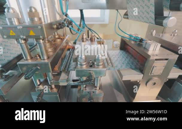 Production of tablets in a modern factory. The manufacturing process of ...