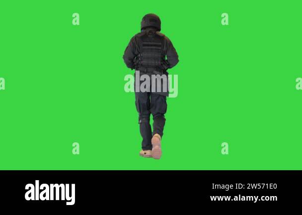 Swat SWAT man in uniform running on a Green Screen, Chroma Key Stock ...