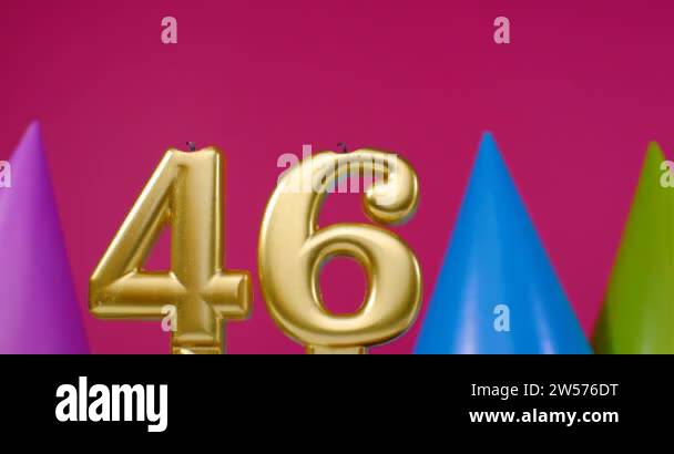Burning birthday cake candle number 46. Happy Birthday background ...
