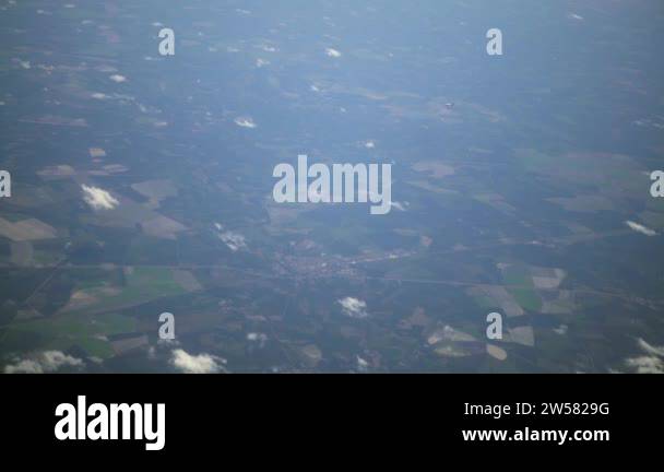 4K, Real plane fly over teh clouds in the sky at day. Aerial of a ...
