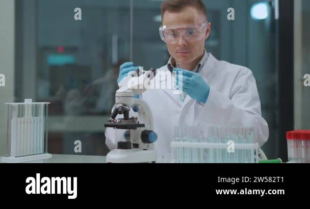 COVID-19 testing in laboratory, male technician is doing PCR and ...
