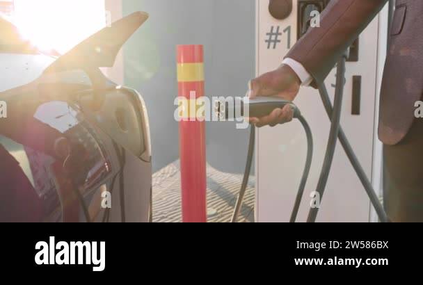 Start of a refueling process of an electric car. A shot under the hatch ...