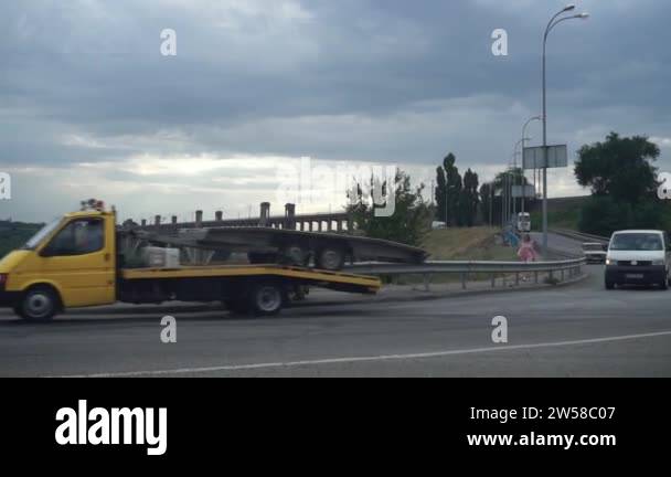girl with disheveled, tattered hair walks alone on unfinished bridge ...