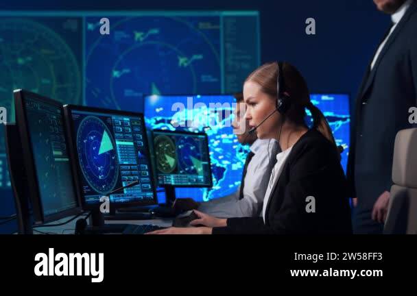 Workplace of the air traffic controllers in the control tower. Team of ...