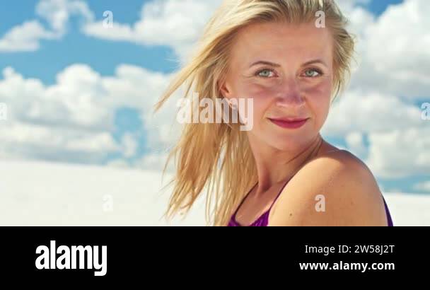 Cinematic slow motion of a woman walking on a sand dune. Barefoot woman ...