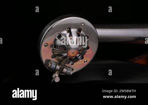 Large needle of a vintage gramophone on vinyl record. Vintage musical ...