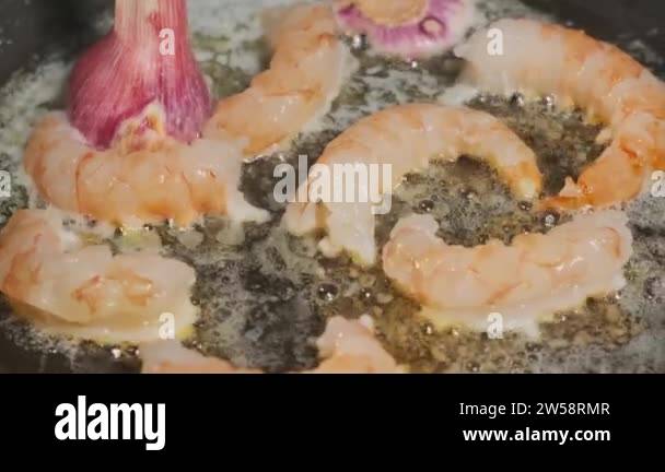 Cook Fries Shrimps In A Pan. Flying Prawns. Cooking On Stove And Frypan ...