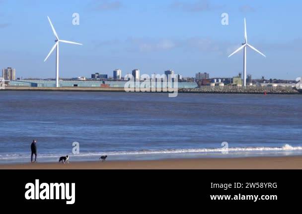 Two wind turbines on the north bank of the River Mersey at Liverpool ...