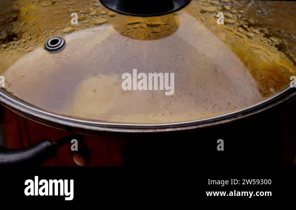 Boiled cassava in a pot with boiling water to making Thai dessert ...