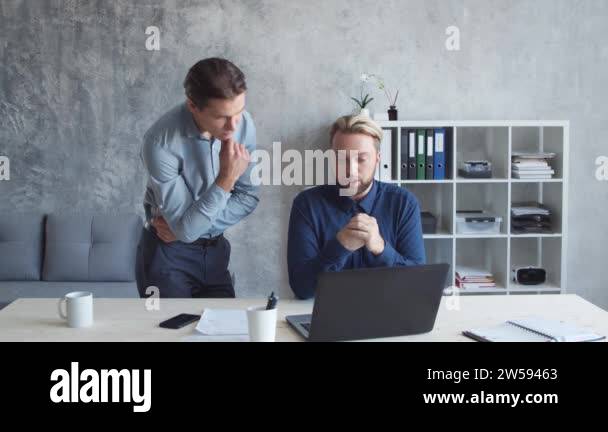 Two business persons are work together in modern office. Team of ...