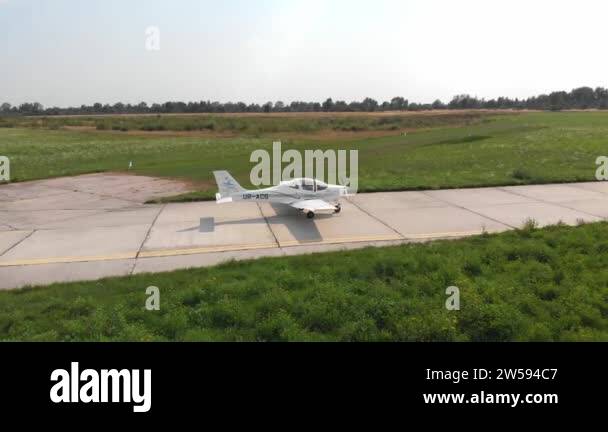 Small private jet airplane with spinning propeller stand on landing ...