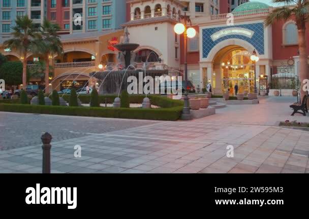 The pearl in Doha Qatar sunset zooming in shot showing the central ...