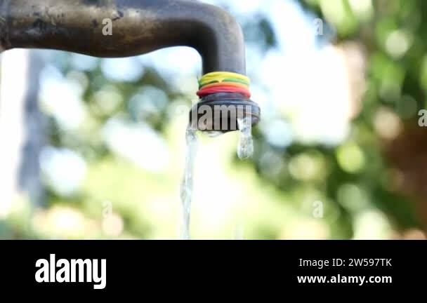 Close up tap water pouring from faucet Stock Video Footage - Alamy