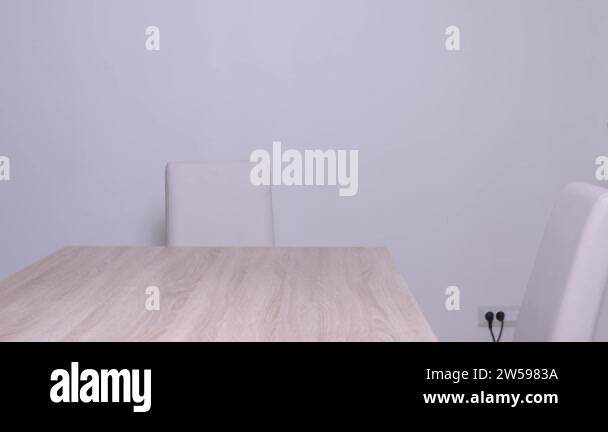 Young couple sit down at table for peace talks or marital psychological ...