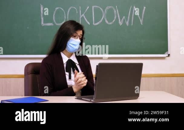 remote teaching, lockdown at schools. Online schooling, e-learning. Female teacher, in ...