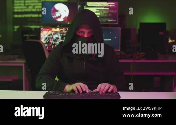 Horizontal medium portrait footage of unrecognizable male hacker ...