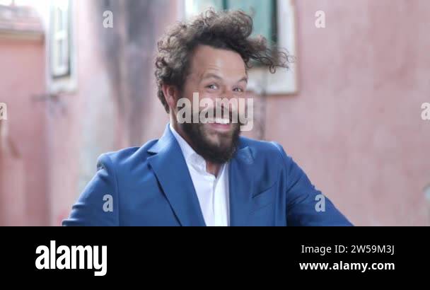 excited smart casual man smiling, getting angry, rage reacting ...