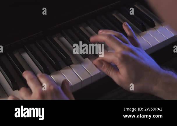 Musician plays piano during a live performance. right hand playing keys ...