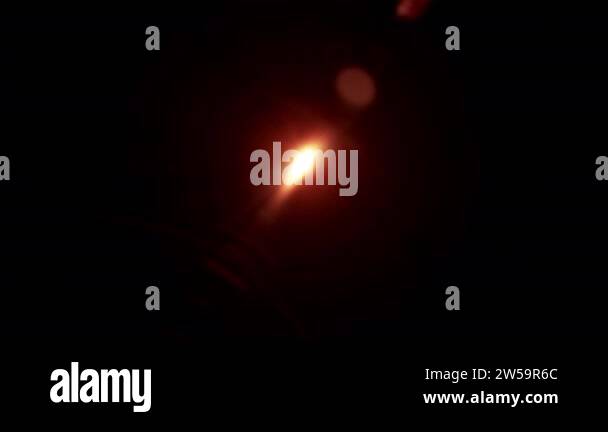 4k Optical lens flare with halo corona effect flicker and burst light background Loop. Animation ...