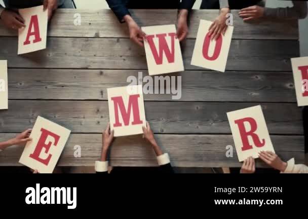 Multi-ethnic group of diverse people putting letters teamwork business ...