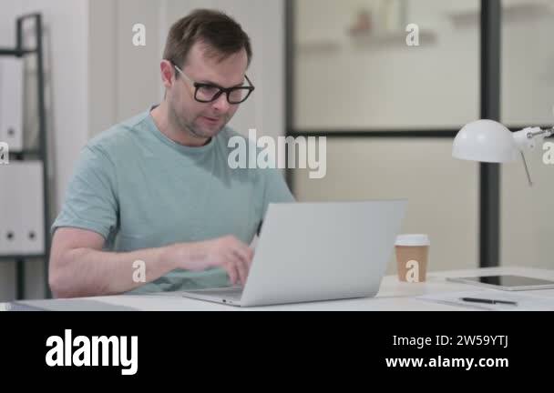 Disappointed young man typing Stock Videos & Footage - HD and 4K Video ...